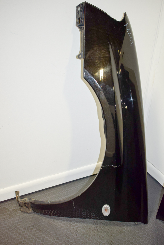 04 05 WRX STi Sedan Nose Cut in Java Black Pearl.